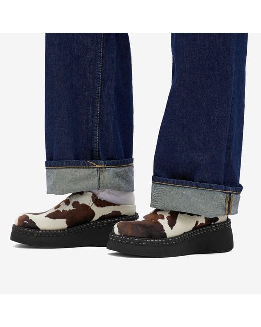 Miista Cow Print Wedge Mules in Brown | Lyst