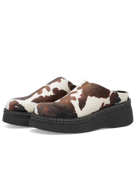 Miista Cow Print Wedge Mules in Brown | Lyst