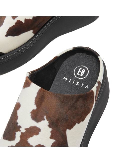 Miista Cow Print Wedge Mules in Brown | Lyst