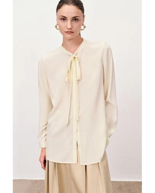 Fabrique Linde Ribbon Tie Flowy Blouse in Natural | Lyst UK