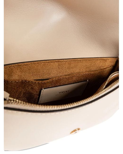 Versace Mini Tag Logo Charm Crossbody Bag in Natural | Lyst UK