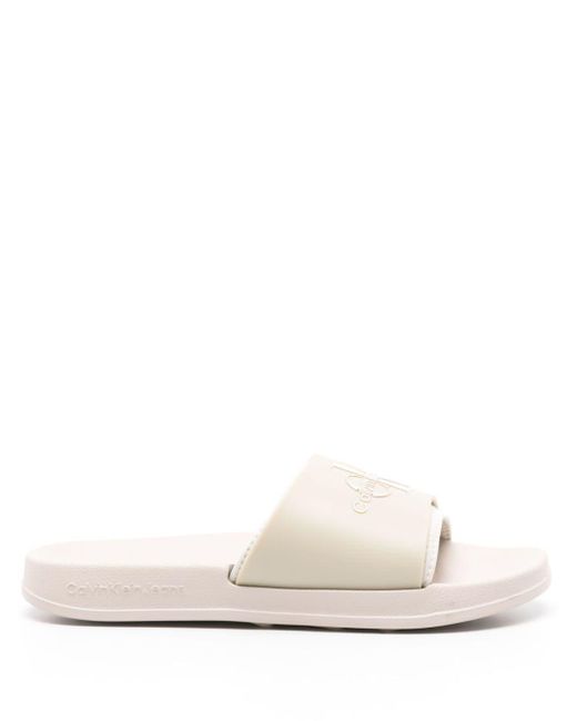 Calvin Klein Logo-Embossed Layered Slides in White | Lyst Calvin Klein Logo-Embossed Layered Slides in White | Lyst