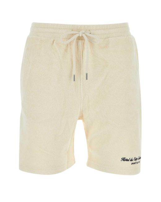 Sporty & Rich Cream Terry Fabric Hotel Du Cap Cursive Shorts in Natural ...