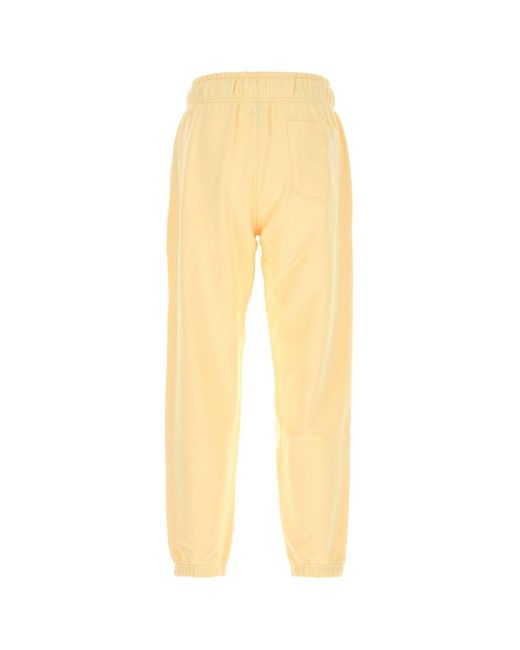 New Balance Pastel Yellow Cotton joggers for Men | Lyst UK