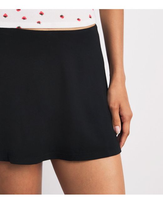 Skims Smooth Layers Mini Skort in Black | Lyst