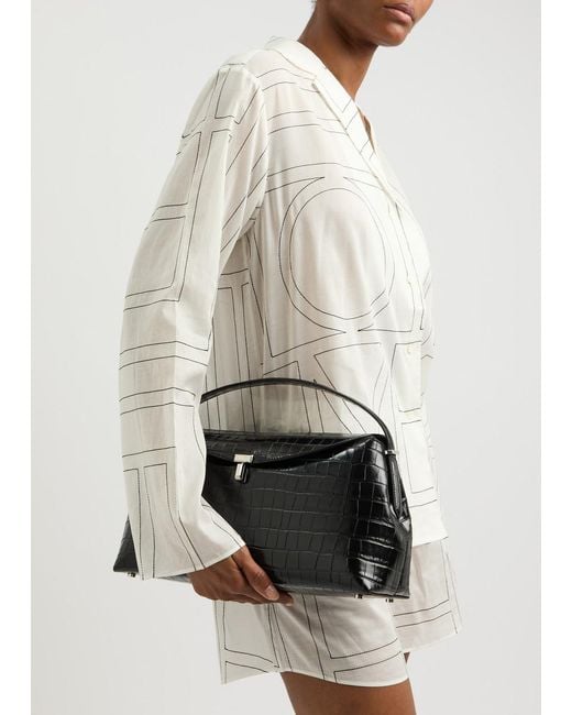 Totême Toteme T-Lock Crocodile-Effect Leather Top Handle Bag in Black | Lyst