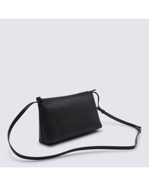 The Row Dark Leather Rene Crossbody Bag in Black | Lyst UK