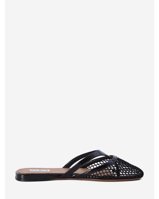 Alaïa Flat Thong Sandals in Black | Lyst
