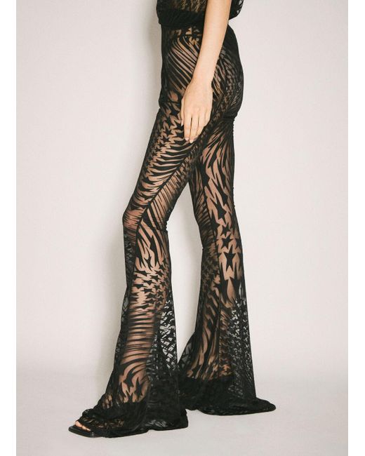Mugler Star Flocked Mesh Flare Pants in Black | Lyst