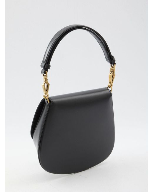 Saint Laurent Bascule Cloche S Bag Golden Logo in Black | Lyst