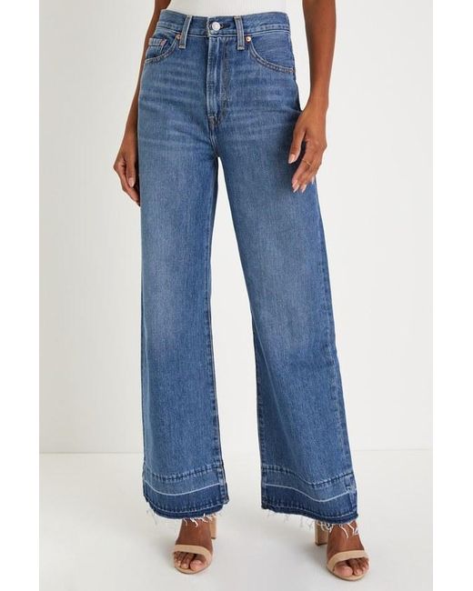 Levi's Ribcage Medium Wash Wide-Leg Raw Hem Denim Jeans in Blue | Lyst