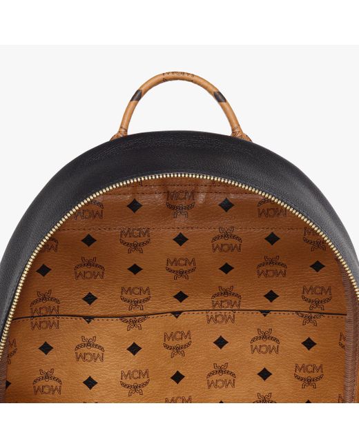 MCM Stark Backpack In Embossed Logo Leather in Black for Men | Lyst