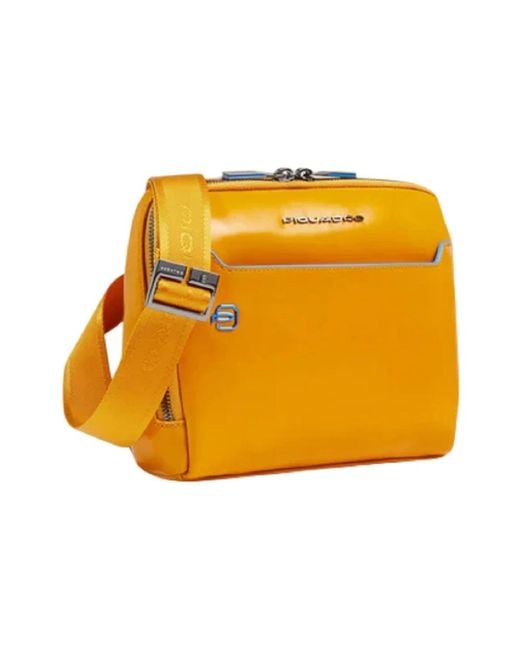 Piquadro Cross Body Bags in Yellow | Lyst UK