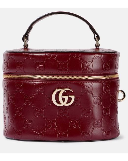 Gucci Gg Embossed Leather Vanity Bag in Red | Lyst