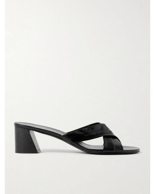 KHAITE Liria Glossed-Leather Mules in Black | Lyst UK