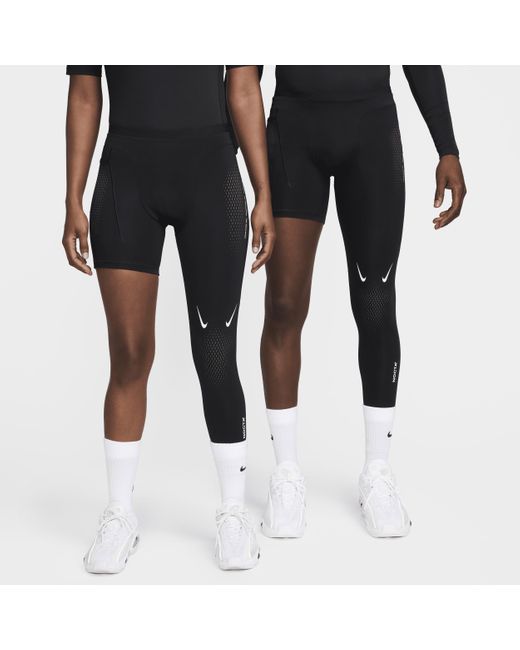 Nike Nocta Single-leg Basketball Tights (left) Polyester/elastane in ...