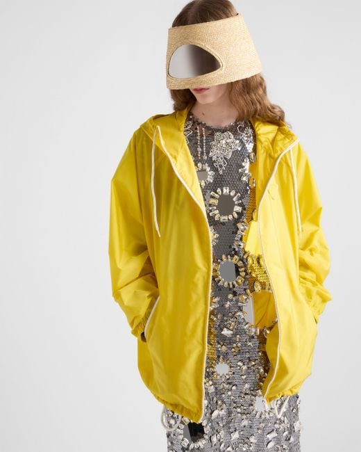 Prada Lightweight Re-Nylon Rain Jacket in Yellow | Lyst