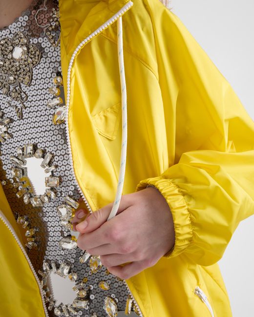 Prada Lightweight Re-Nylon Rain Jacket in Yellow | Lyst