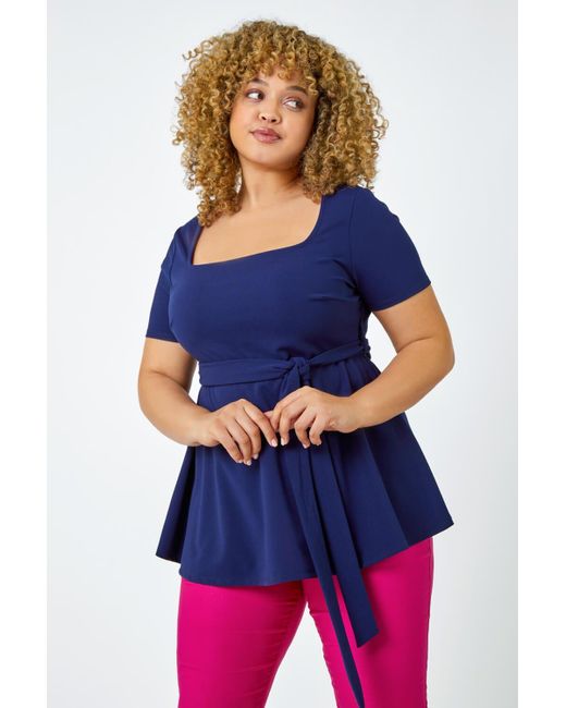 Roman Curve Stretch Belted Peplum Top in Blue | Lyst UK