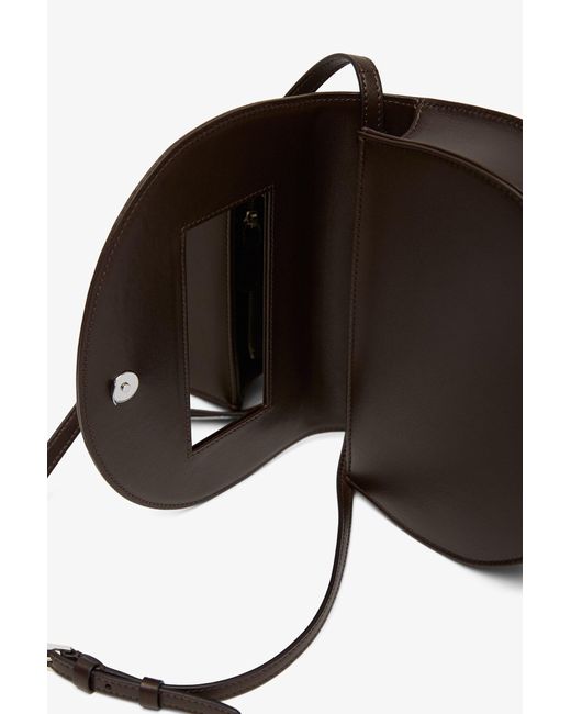 The Row Canteen Dark Brown Crossbody Bag in White | Lyst