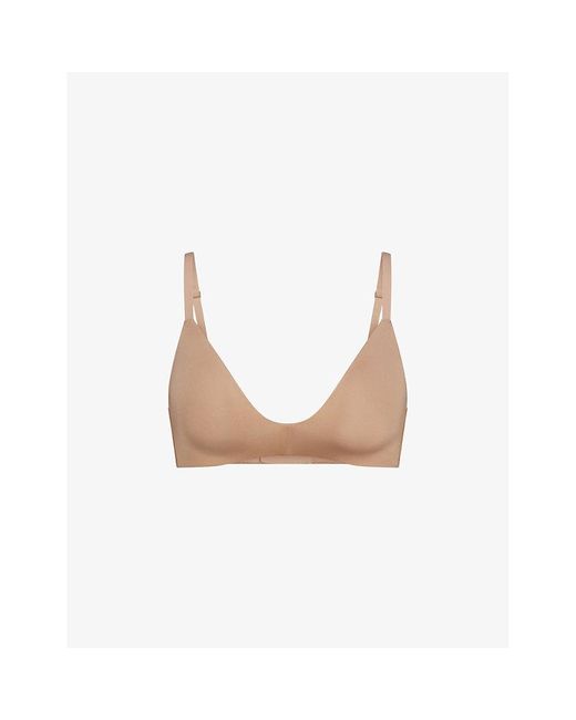 Skims Wireless Form Logo-Embossed Padded Stretch-Cotton Bra in White ...