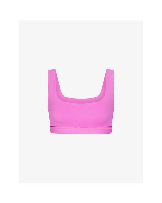 Skims Signature Swim Tank Stretch Recycled-Nylon Bikini Top in Pink ...