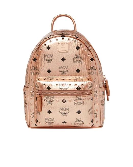 MCM Logo Printed Rivet Backpack in Pink | Lyst