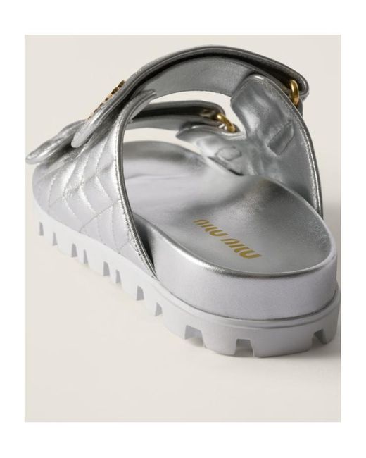 Miu Miu Metallic Matelassé Nappa Leather Slides in White | Lyst