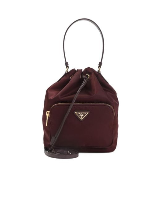 Prada Logo Plaque Drawstring Bucket Bag in Red | Lyst