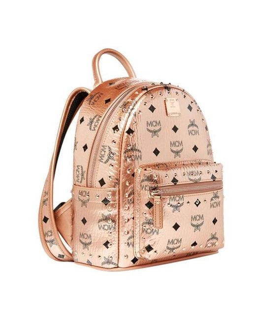 MCM Logo Printed Rivet Backpack in Pink | Lyst
