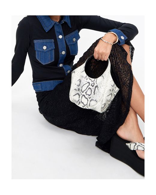 Coperni Embossed Mini Swipe Bucket Bag in Natural | Lyst