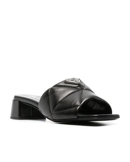 Prada Triangle Logo Quilted Mules in Black | Lyst