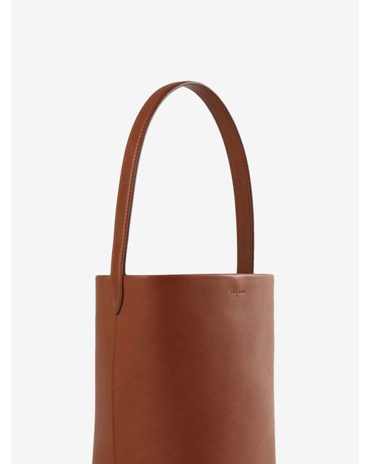 The Row Small Lasso Handbag in Brown | Lyst