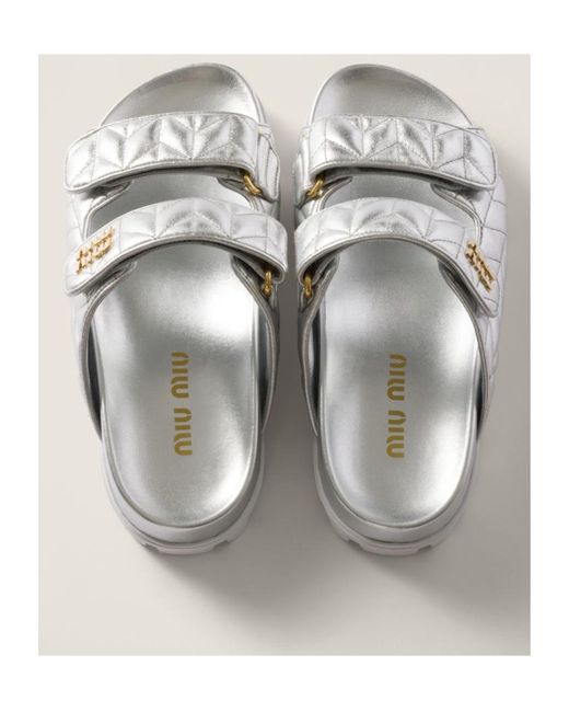 Miu Miu Metallic Matelassé Nappa Leather Slides in White | Lyst