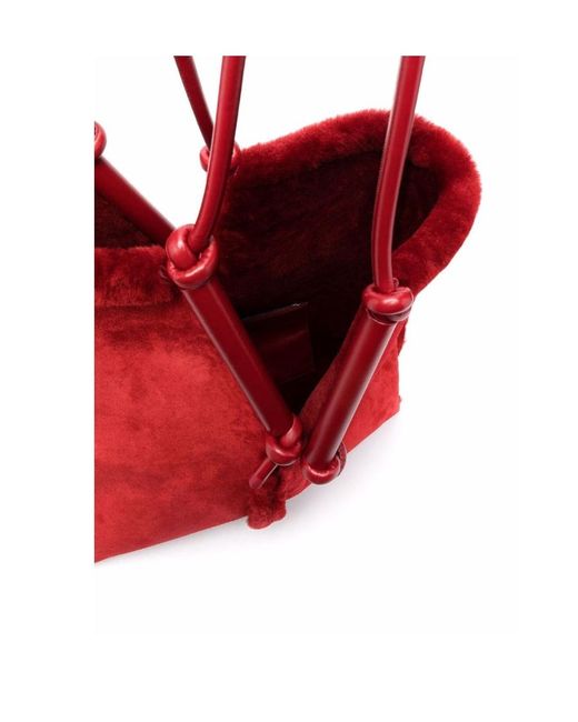 Bottega Veneta Bolster Reversible Shearling Suede Bag in Red | Lyst