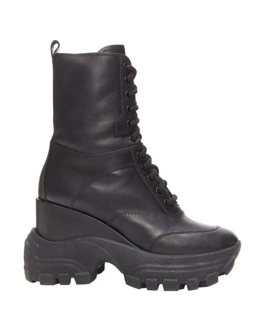 Miu Miu Leather Logo Lace Up Chunky Wedged Military Boots in Black | Lyst