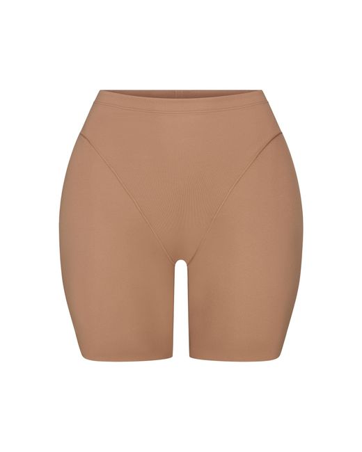 Skims Butt And Hip Enhancing Mid Thigh Short in Natural | Lyst