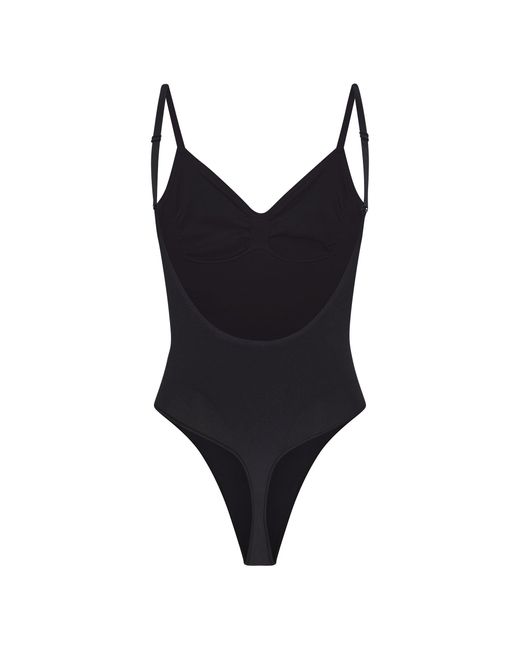 Skims Low Back Thong Bodysuit in Black | Lyst