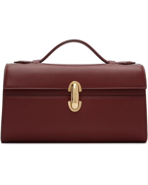 SAVETTE Burgundy Symmetry Pochette Bag in Red | Lyst