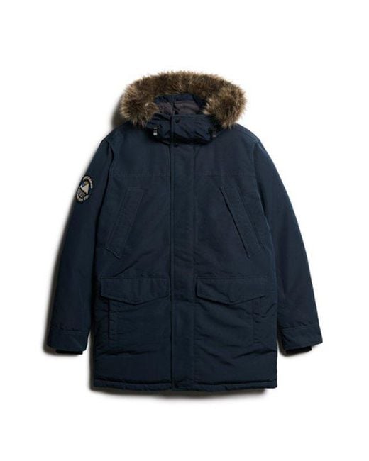 Superdry Loose Fit Embroidered Logo Everest Faux Fur Parka Jacket in ...