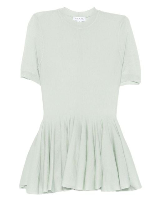 Alaïa Wool Peplum Top in White | Lyst UK