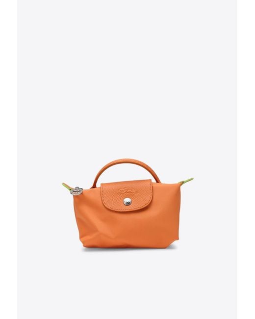 Longchamp Le Pliage Clutch Bag in Orange | Lyst