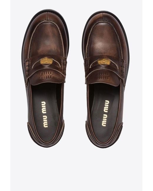 Miu Miu Logo Embossed Calf Leather Loafers in Brown | Lyst