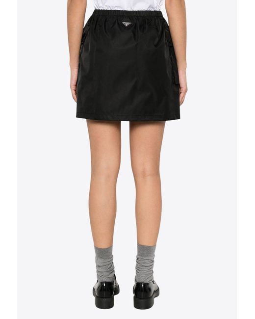 Prada Re-Nylon Triangle Logo Mini Skirt in Black | Lyst
