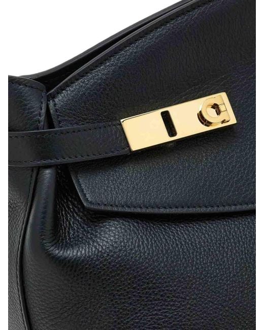 Ferragamo Large Hug Pouch Leather Bag in Black | Lyst