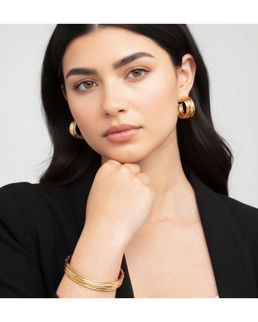Uchi and Soto Nami Twist Earrings in Metallic | Lyst UK