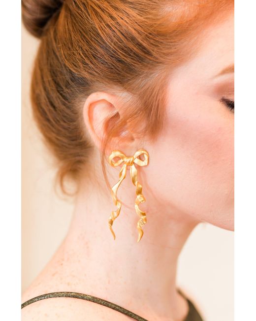 The Pink Reef Elongated Bow in Metallic | Lyst UK