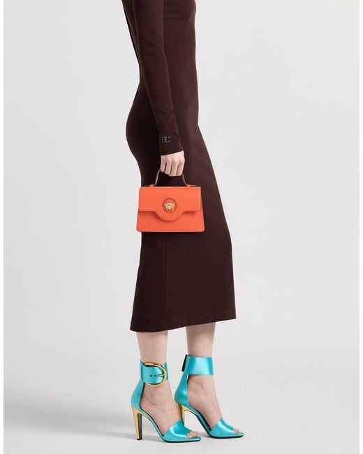 Versace Handbag in Orange | Lyst