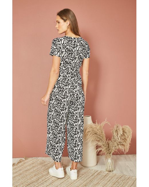 Yumi' And Wrap Over Stretch Jumpsuit in Black | Lyst UK