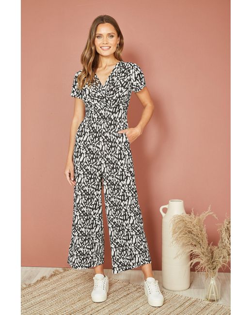 Yumi' And Wrap Over Stretch Jumpsuit in Black | Lyst UK